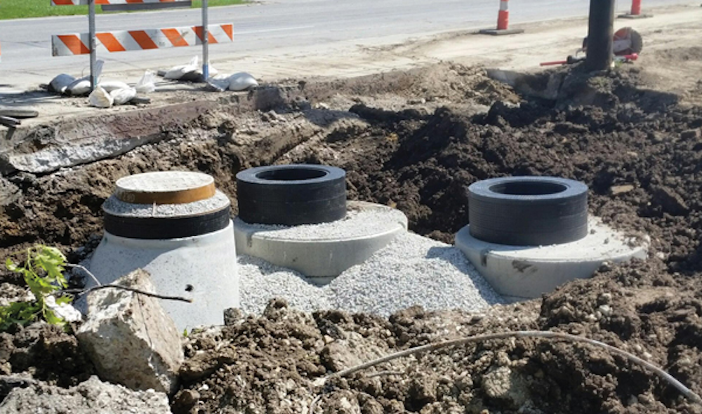 Manhole grade adjustment system | WaterWorld
